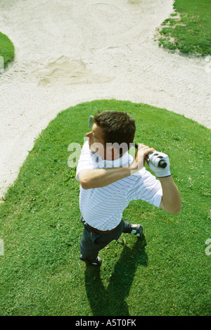 A golfer swinging a golf club, overhead view Stock Photo - Alamy