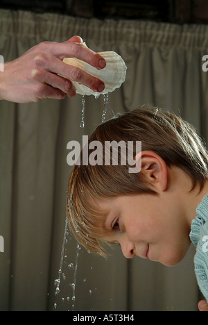 Christian baptism Sacrament, anointing a child’s head with holy water ...