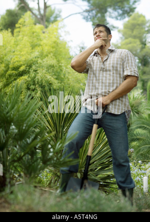 Man doing yard work Stock Photo - Alamy