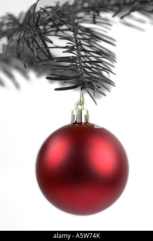 Red bauble dangling from branch of fir tree Stock Photo - Alamy