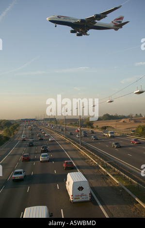 Jumbo jet passes over the M25 Motorway just before landing at London's ...