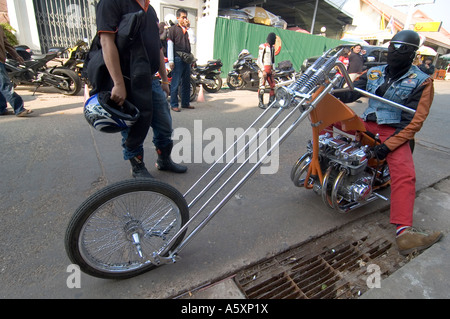 A Thai biker on his chopper motorcycle during a bikie meeting in Nong ...