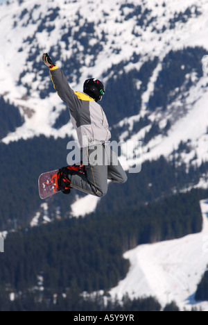 Snowboarder performing aerial tricks Stock Photo - Alamy