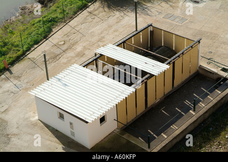 Sewage treatment plant works the rotating arm pours sewage over the ...