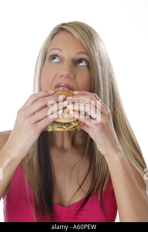 Young Woman Eating Hamburger Model Released Stock Photo - Alamy