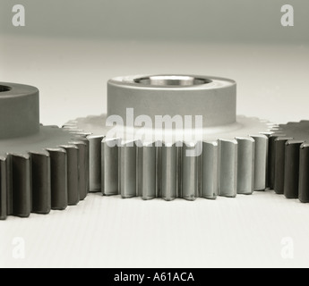 Synchronized gears connected Stock Photo - Alamy
