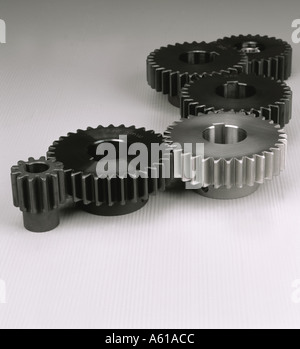 Synchronized gears connected Stock Photo - Alamy