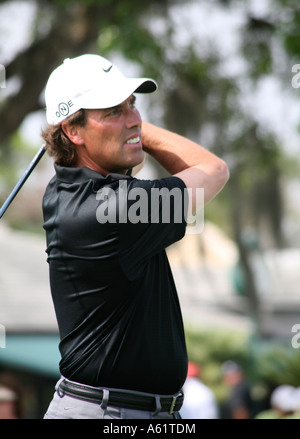 PGA Tour player Phil Mickelson climbs out of Dale Jarrett's racing car ...