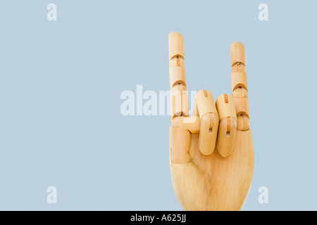 Wooden hand corna horned hand gesture Stock Photo - Alamy