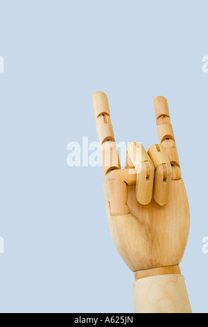 Wooden hand corna horned hand gesture Stock Photo - Alamy