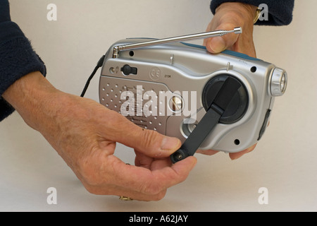hand winding up a torch Stock Photo - Alamy
