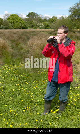 man birding watching at Heysham Moss nature reserve With red jacket ...