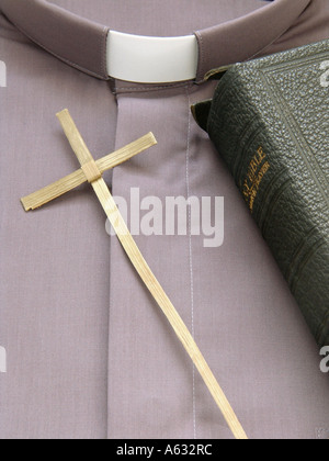 Vicar collar with Bible and cross GB UK 2006 Stock Photo - Alamy