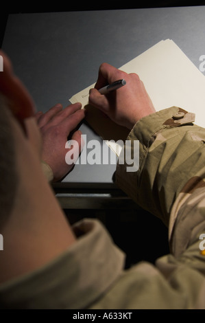 Military man writing letter Stock Photo - Alamy