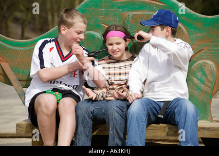 Two boys playing cops and robbers Stock Photo - Alamy