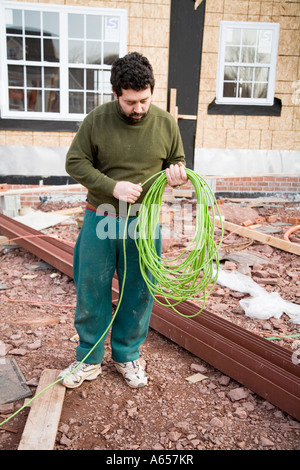 Immigrant Construction Worker Finishing Work Stock Photo - Alamy