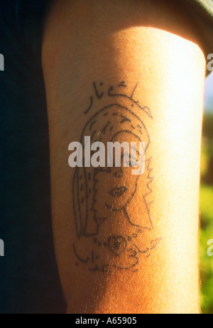 tribesman tattoo on his arms Stock Photo - Alamy