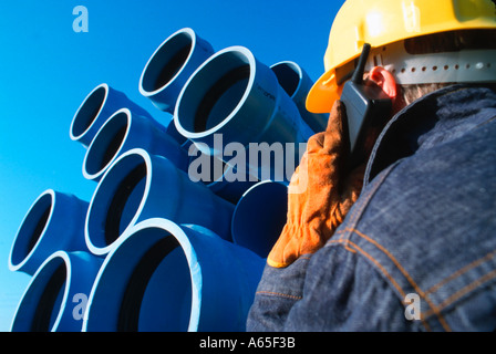 construction foreman and large sewer pipes Stock Photo - Alamy