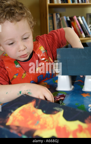 4 yr old boy building rocket Stock Photo - Alamy