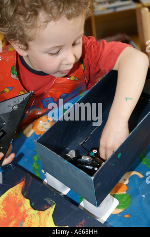 4 yr old boy building rocket Stock Photo - Alamy