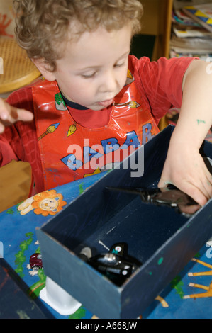 4 yr old boy building rocket Stock Photo - Alamy
