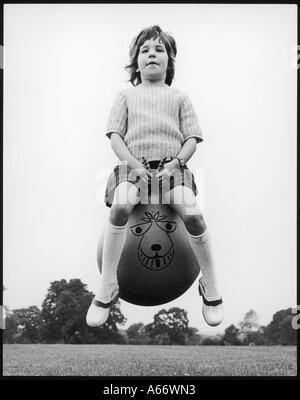 Girl on a Spacehopper Stock Photo - Alamy
