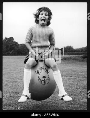 Girl on a Spacehopper Stock Photo - Alamy