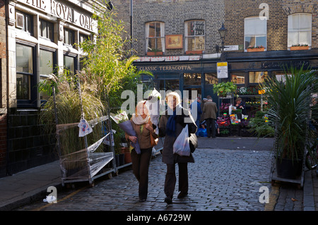 Every Sunday locals flock to the Columbia Road flower market in Hackney ...