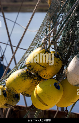 Close up of fishing net rollers Stock Photo - Alamy