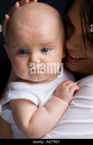 Mother comforts baby Stock Photo - Alamy