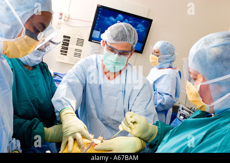 Orthopedic Surgeon Performing A Knee Joint Replacement Operation In A