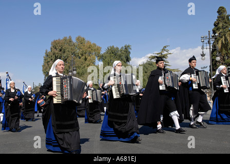 Falleros wearing historic Valencian costume play bagpipes as the march ...