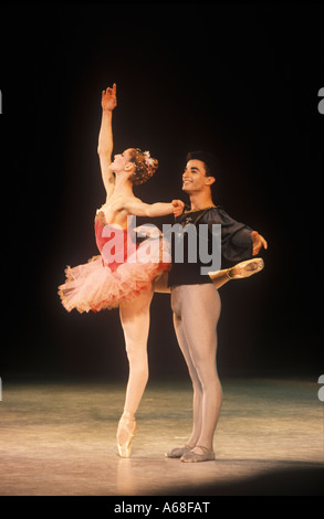 Couple performing ballet dance in front of wall Stock Photo - Alamy