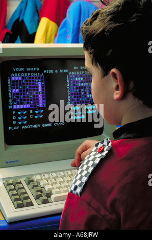 Boy playing computer game Stock Photo - Alamy