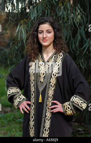 A beautiful pretty young Lebanese woman/model poses in a studio setting ...