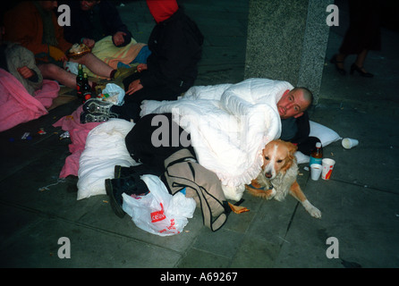 Group of homeless settling down for the night Victoria Street London ...