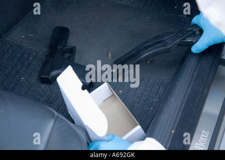 Sharp's Tongs being used to retrieve hypodermic syringe Stock Photo - Alamy