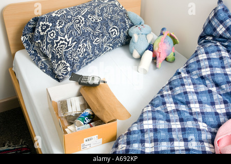 Drug dealers stash in box in bedroom Stock Photo - Alamy