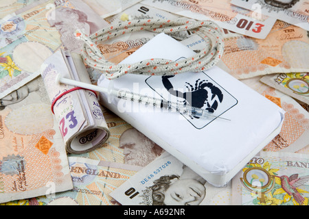 Packaged drugs with rope and syringe Stock Photo - Alamy