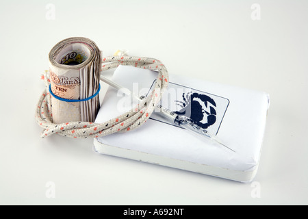 Packaged drugs with rope and syringe Stock Photo - Alamy