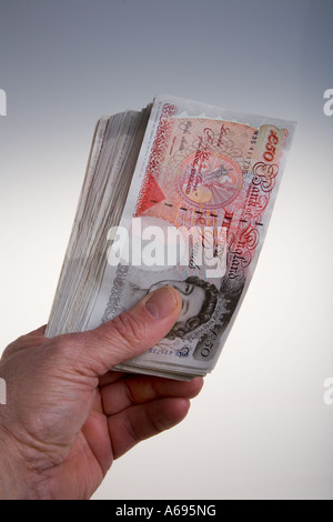 Fan of Twenty Pound Notes with Hand Stock Photo - Alamy