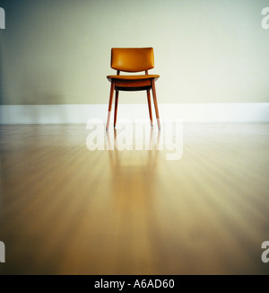 Single Chair In Empty Room Stock Photo - Alamy