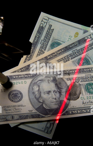 Laser scanning fingerprint on currency Stock Photo - Alamy