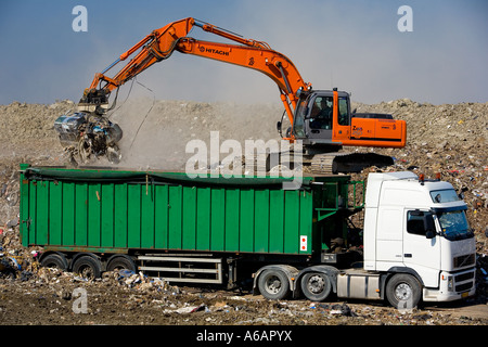 Mechanical digger loading dirt into lorry Crete Greece Stock Photo - Alamy