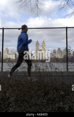 Jogger running alongside the Central Park Reservoir Stock Photo - Alamy