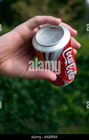 hand and fingers of man with can of coca cola in the blue sky Stock ...