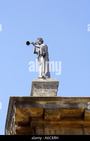 Statue of stone angel looking from below blue sky background Stock ...