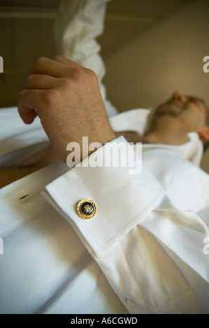 Italian wedding man adjusting cuff links Stock Photo - Alamy