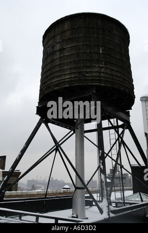 Water tower tank struts roof winter snow NY vertical Stock Photo - Alamy