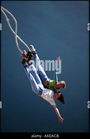 Two girls tandem bungy jumping Stock Photo - Alamy